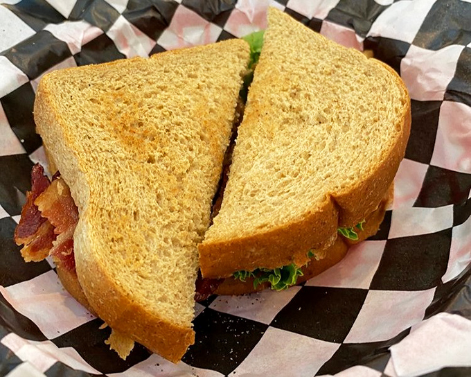 The BLT here isn't just a sandwich&mdash;it's architecture, with perfectly crisp bacon creating structural integrity for this lunchtime masterpiece.