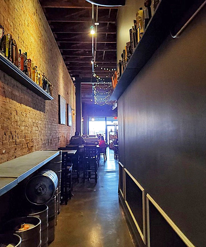 The hallway lined with vintage beer taps creates an atmosphere where every step toward your table builds anticipation perfectly.
