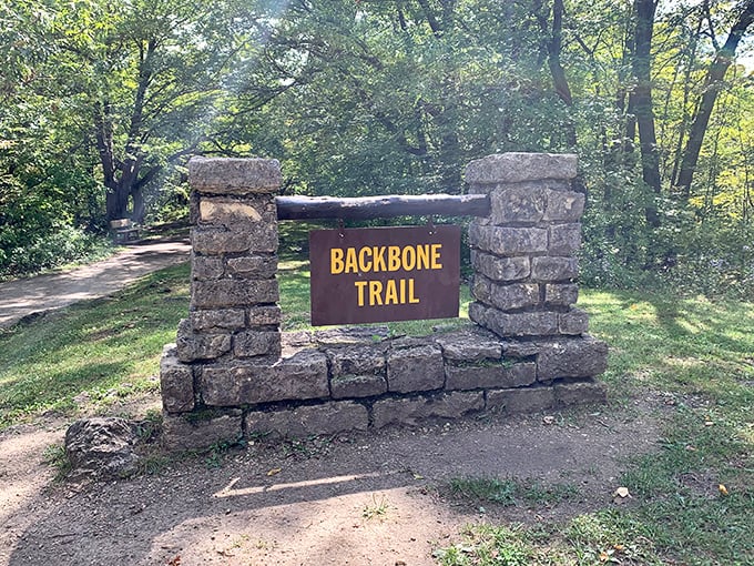 The Backbone Trail sign marks the beginning of your journey into Iowa's geological greatest hits collection.