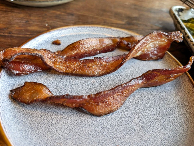 Bacon that's been transformed from breakfast sidekick to main character &ndash; thick-cut, perfectly rendered, and worthy of its own standing ovation.