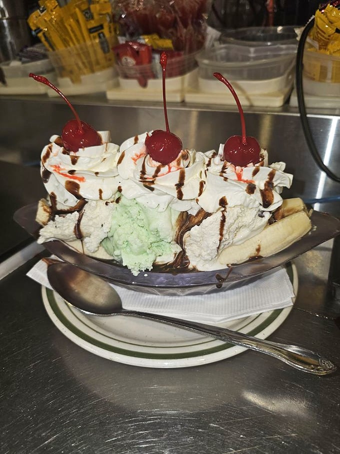 The banana split isn't just dessert—it's three scoops of childhood nostalgia topped with whipped cream mountains and cherry-topped memories.
