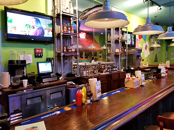 The bar stands ready for thirsty patrons, with bottles lined up like soldiers prepared for the dinner rush battle ahead.