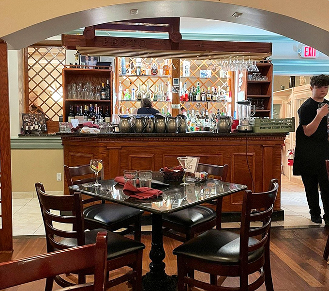 The welcoming bar area where you can enjoy a glass of wine while anticipating culinary greatness ahead.