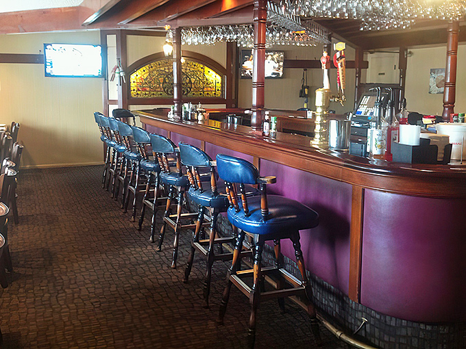 The bar's blue stools stand ready for solo diners, couples on date night, or anyone who understands that seafood tastes even better with a cocktail.