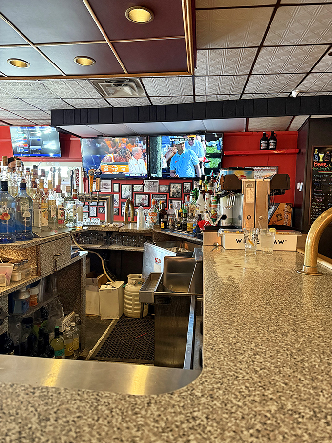 Behind the bar, where magic happens. The bottles stand at attention, ready to complement that perfect tray of Old Forge-style pizza.