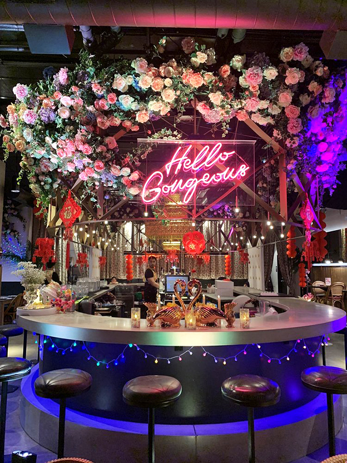 The "Hello Gorgeous" sign isn't just for the customers&mdash;it's what the food whispers to you as it arrives at your table under this floral canopy.