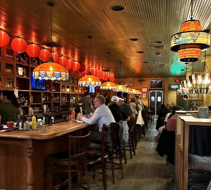 The bar where strangers become friends and friends become family. Those colorful lanterns have witnessed more toasts than a breakfast diner.