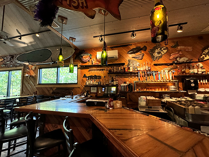 The bar area&mdash;where fishing stories get taller and cocktails disappear faster. Those bottles aren't just spirits&mdash;they're conversation starters.