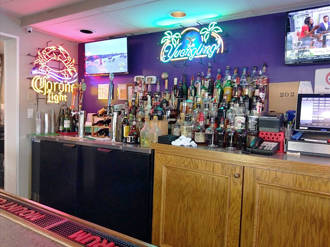 The neon-lit bar glows with promise &ndash; like a lighthouse for thirsty sailors navigating the treacherous waters of a long workweek.