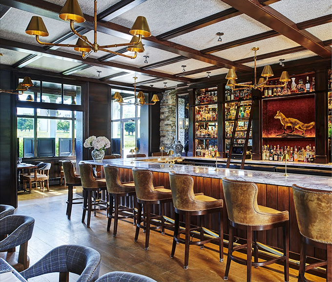 A bar that strikes the perfect balance between "I've arrived" and "I feel at home," complete with golden lighting that makes everyone look like a movie star.