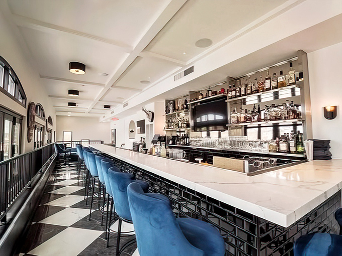 This isn't just a bar&mdash;it's a stage where liquid alchemy happens nightly. Those blue velvet stools are practically begging you to settle in for a Manhattan.