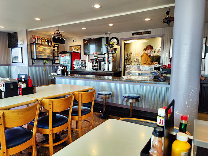 The heart of operations, where coffee flows like jet fuel and servers orchestrate the delicate dance of breakfast rush with practiced ease.