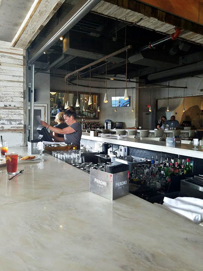 The bar where solo diners become regulars and cocktails come with a side of conversation.