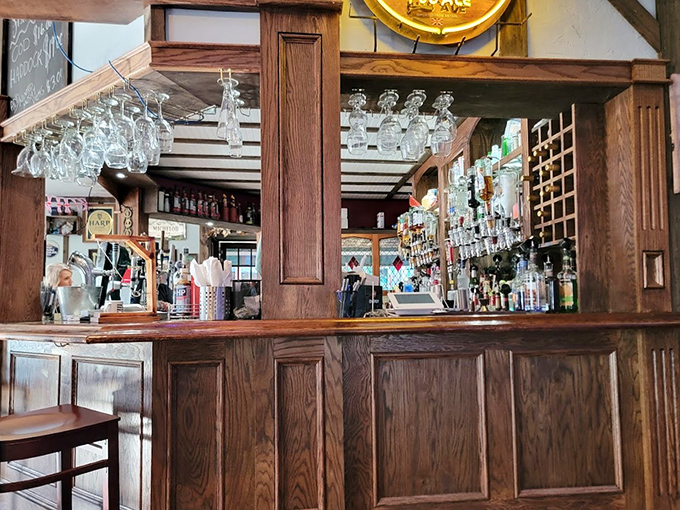 The polished wooden bar showcases an impressive array of spirits. That's not just a drink selection &ndash; it's a liquid library!