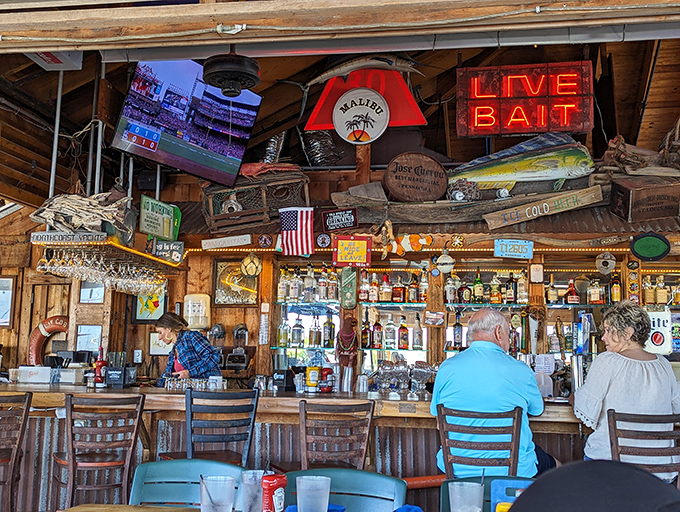 A bar that tells stories! Every hanging license plate, fishing trophy, and weathered sign adds to the authentic "old Florida" character.
