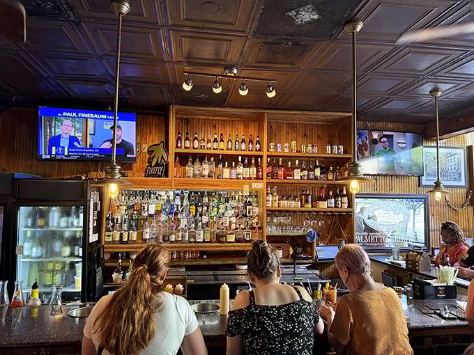 The bar at Hyman's isn't just where drinks are served; it's where stories are exchanged and Charleston's spirits (both kinds) flow freely.