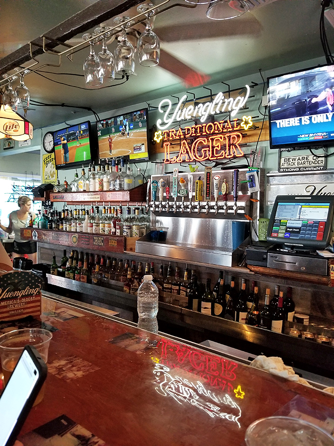 The bar at JB's&mdash;where cold beer flows freely and strangers become friends over stories of "the one that got away."