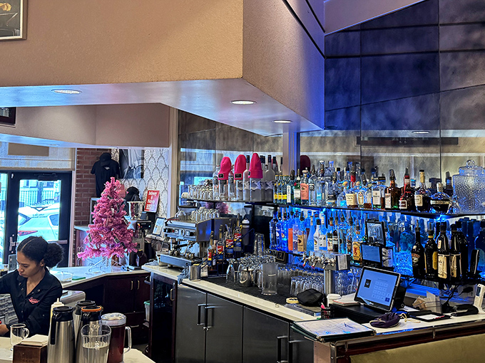 The bar gleams with promise, where breakfast cocktails transform "good morning" into "great morning" with alarming efficiency.