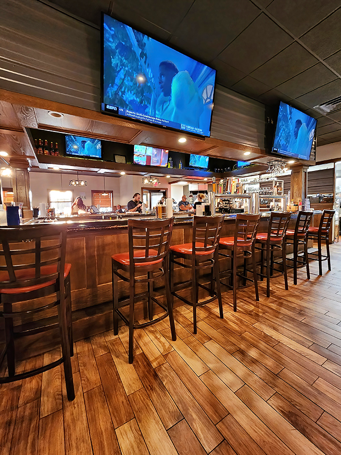 A bar built for lingering, where the TVs are visible but not intrusive, and the bartenders remember what you drink after just two visits.