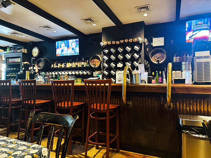 Behind this bar, magic happens. Those mugs hanging overhead aren't just decoration&mdash;they're badges of honor for the tavern's loyal patrons. 