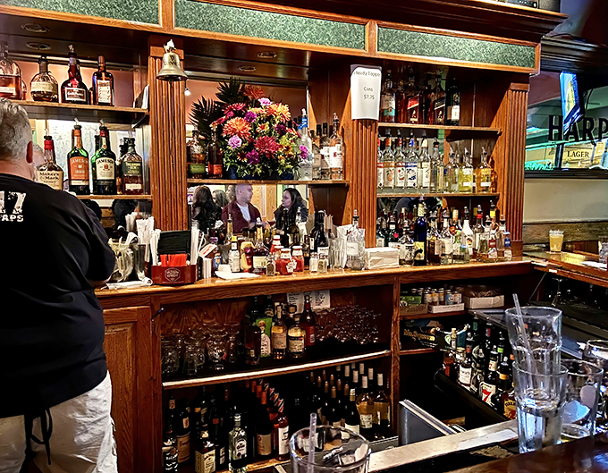 Behind this well-stocked bar, bottles gleam like treasures in a pirate's chest &ndash; liquid gold waiting to be transformed into happiness.