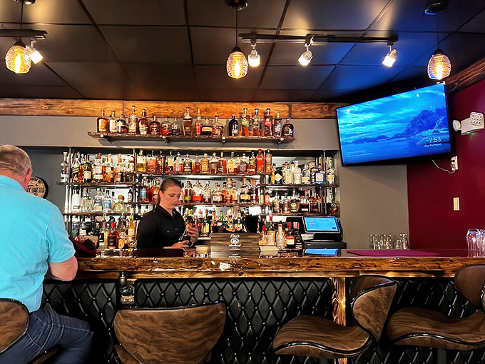 The bar showcases an impressive bourbon collection that would make Kentucky proud, all waiting to complement your steak or stand proudly on their own.