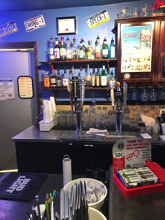 The bar area isn't just serving drinks&mdash;it's serving community. Those license plates on the wall have stories almost as good as the cocktails.