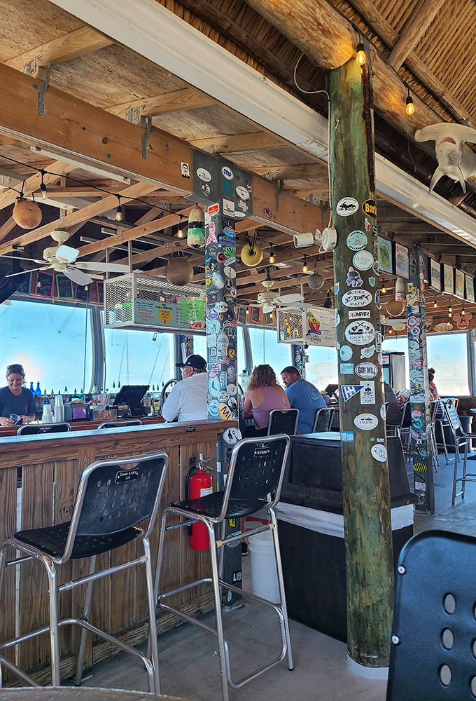 The casual bar area where locals and visitors alike gather to share stories over exceptional seafood.