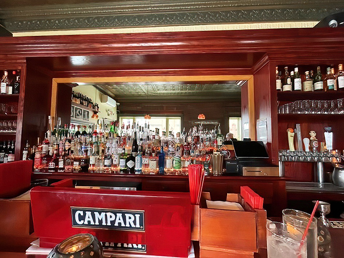 The intimate bar area invites lingering conversations over perfectly crafted cocktails and exceptional Italian wines.