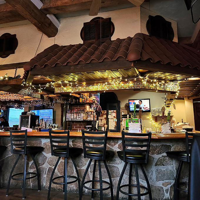 Bar seating that invites you to settle in and stay awhile—the kind of place where strangers become friends over good drinks.