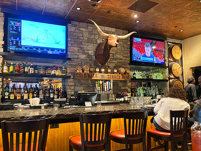 The longhorn watching over the bar seems to say, "Trust me, the steaks here are worth every penny."