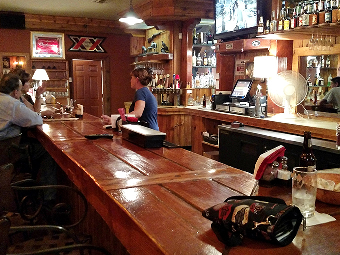 The saloon's wooden bar has likely heard more Arizona tall tales than a park ranger, all while keeping glasses happily filled.