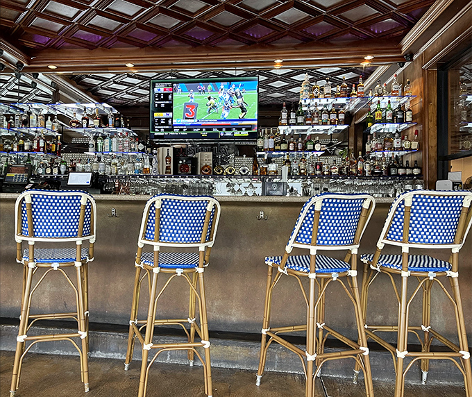 The bar area combines maritime charm with Miami cool&mdash;where blue bistro chairs invite you to perch and watch the bartender's seafood-pairing magic.