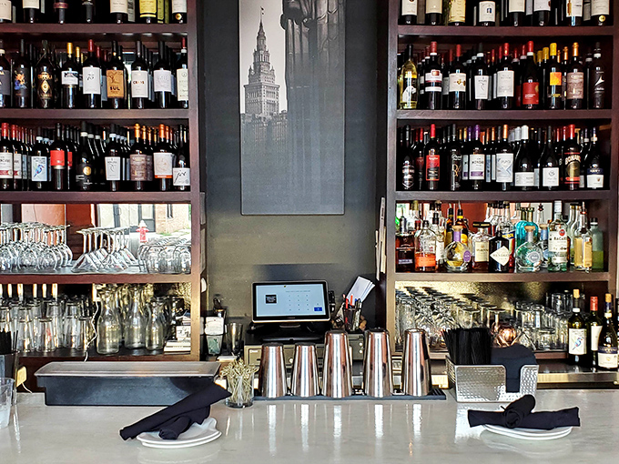 A bar stocked not to impress cocktail snobs but to complement great food. That Cleveland skyline photo watches over bottles like a proud parent.