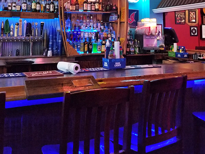 The bar glows with promise and possibility, a beacon for thirsty travelers in a sea of memorabilia.