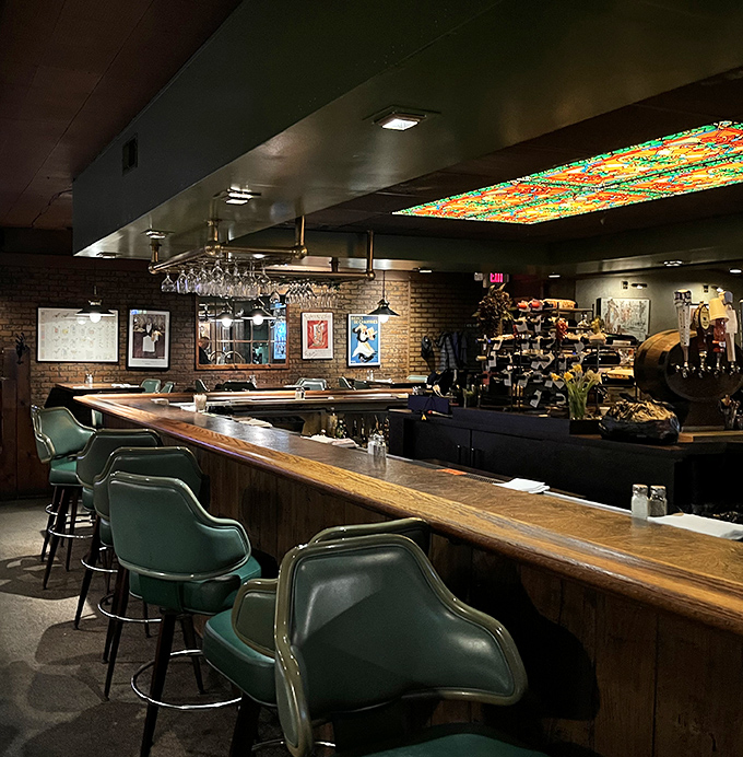 The bar's stained glass ceiling feature adds unexpected artistry to a space that otherwise keeps things refreshingly straightforward.