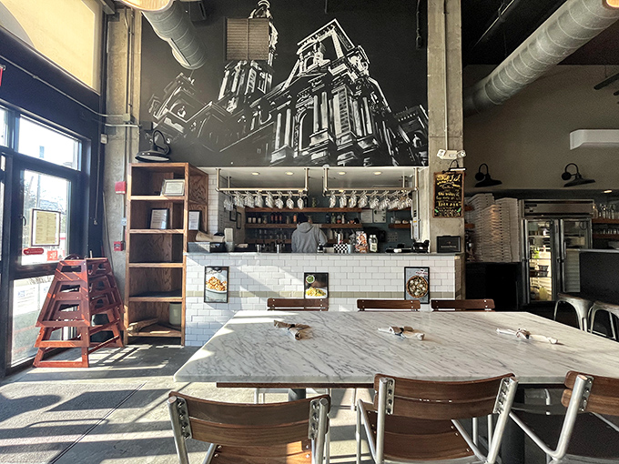 Philadelphia architecture meets Italian inspiration on the walls, while the bar promises liquid companions for your pizza journey.