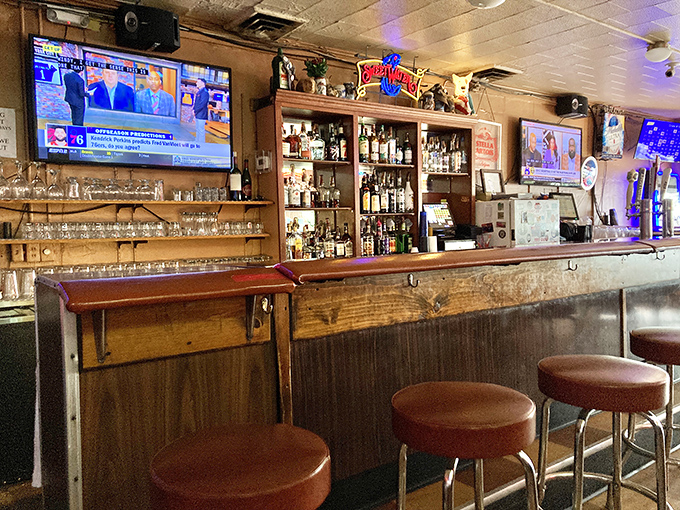 The bar area—where stories get better with each telling. Those stools have supported the weight of both everyday troubles and life's greatest celebrations.