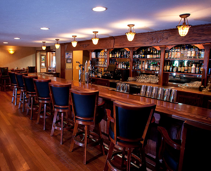 The bar beckons with its warm wood tones and promise of expertly crafted cocktails&mdash;resistance is futile.