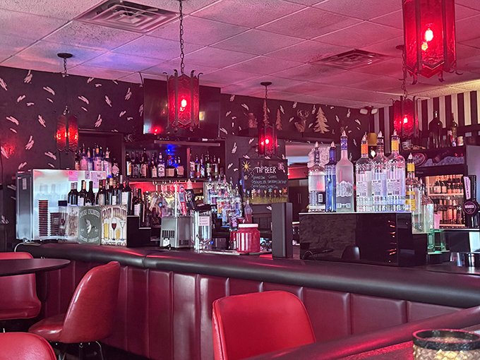 The bar area glows with red lantern light, creating the perfect backdrop for that "one more drink" that turns into memorable conversations.