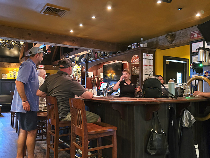 The heart of any proper pub &ndash; a bar where stories flow as freely as the beer. Notice the wooden details that speak to craftsmanship rarely seen in modern establishments.
