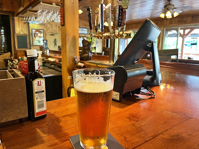 The wooden bar beckons with craft beer taps and rustic charm that would make any saloon proud.