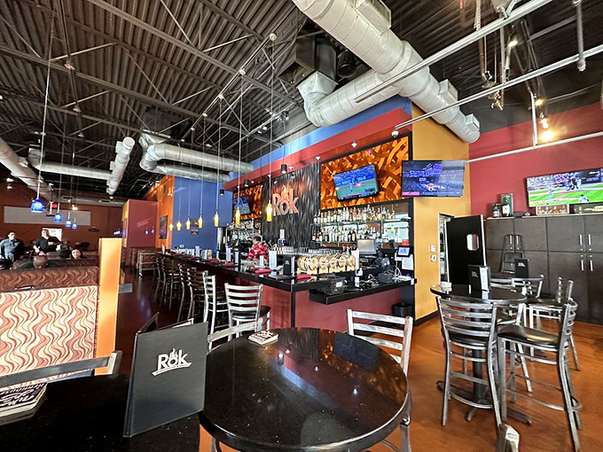 A bar area that invites you to linger over craft cocktails while watching others navigate their volcanic cooking adventures.