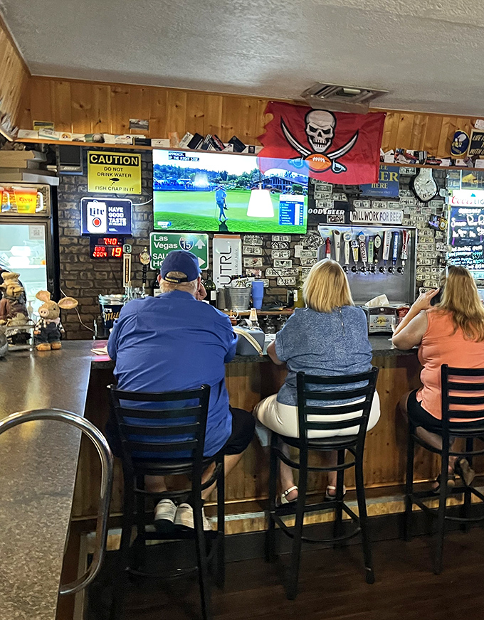 The bar area&mdash;where sports on TV and barbecue tales flow freely. Notice the Tampa Bay Bucs flag&mdash;Florida pride runs deep here.
