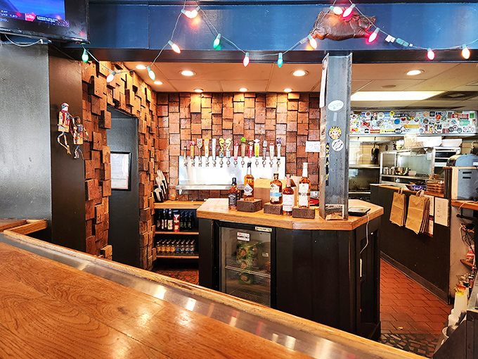 The bar area's brick wall and tap selection create a warm backdrop for the serious business of beer-and-barbecue pairing.