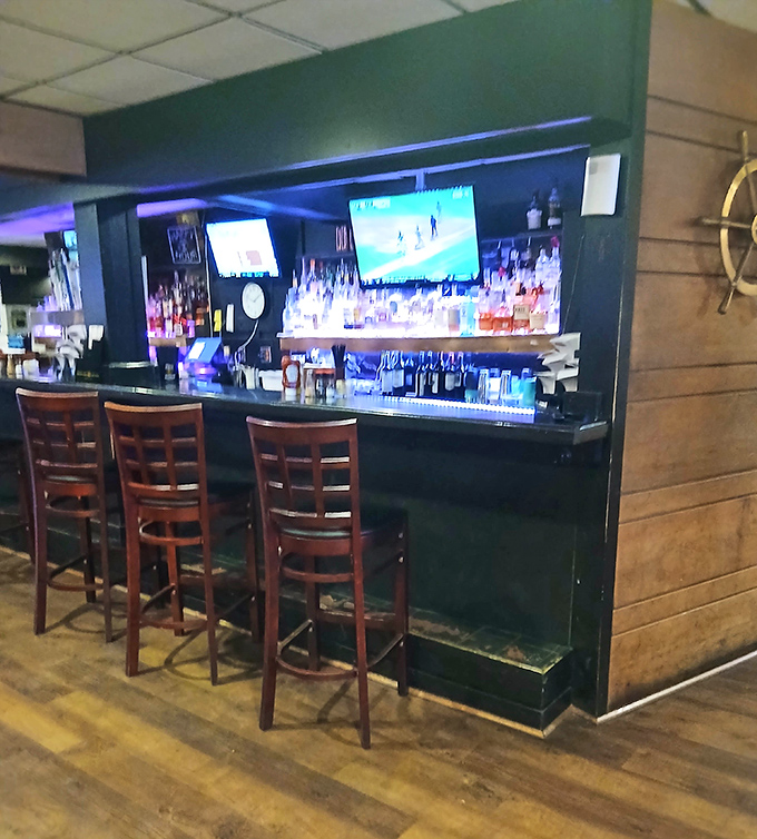 The bar area offers front-row seats to liquid artistry, with enough options to complement whatever treasure from the sea lands on your plate.