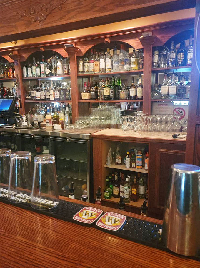 A bar that would make any whiskey enthusiast weak in the knees with its impressive collection and craftsmanship.