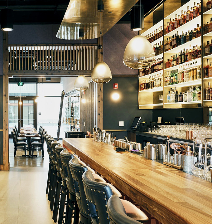 The bar's where solo diners live their best life, not sharing their sardine chips with anybody.