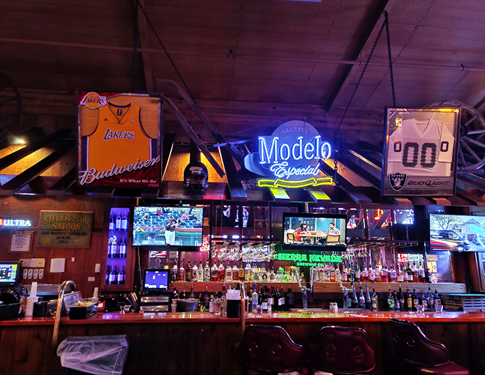 The bar at Cattlemens&mdash;where sports memorabilia meets neon beer signs in perfect harmony. A watering hole worthy of post-trail cowboys and modern-day carnivores alike.
