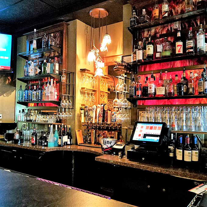 A bar stocked for serious business. This isn't amateur hour—it's where proper drinks are crafted while racing stories get taller with each round.